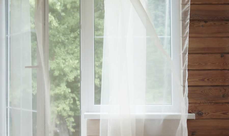 Open Window With Curtains Blowing